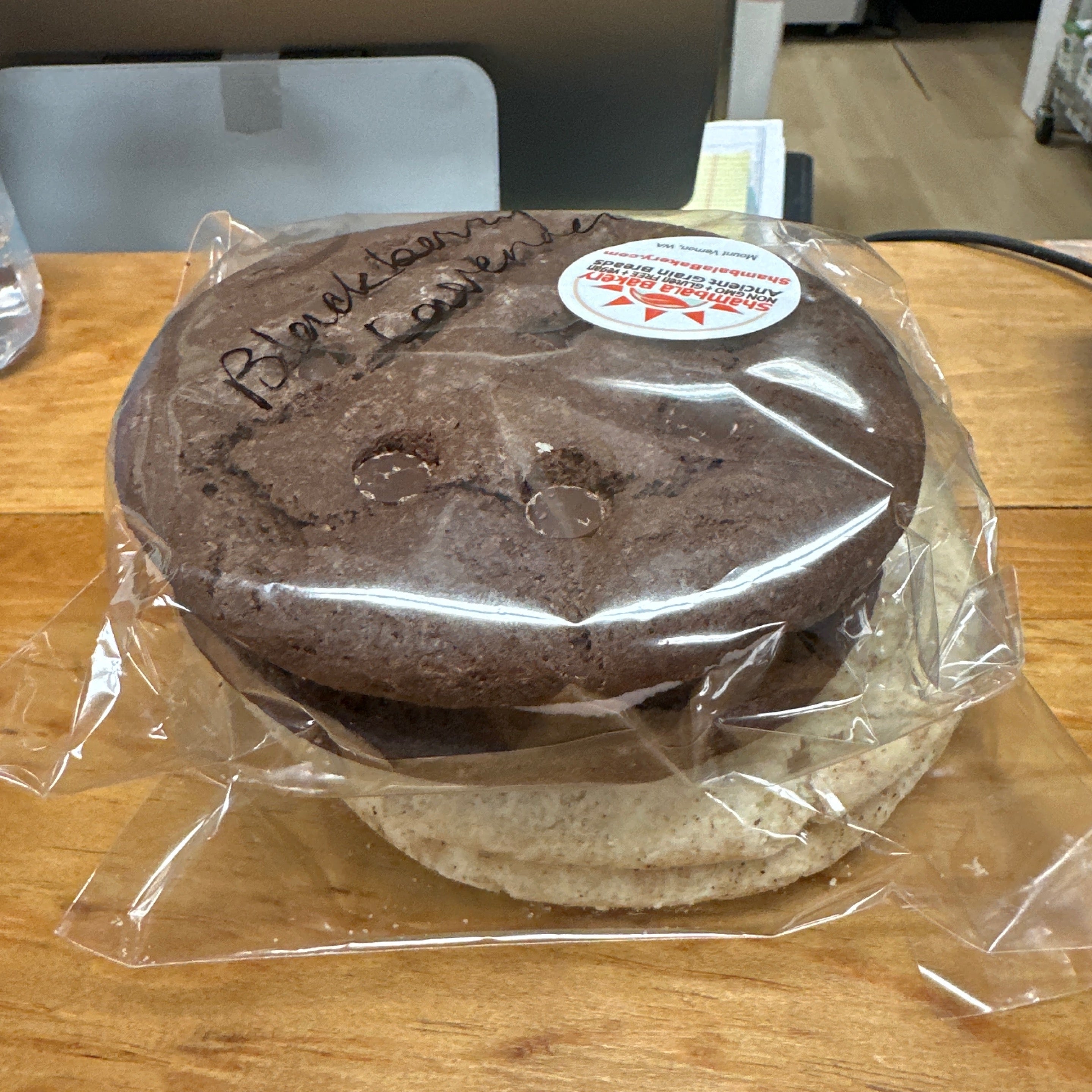 Large, iced cookie Shambala Bakery | Cosmic Veggies
